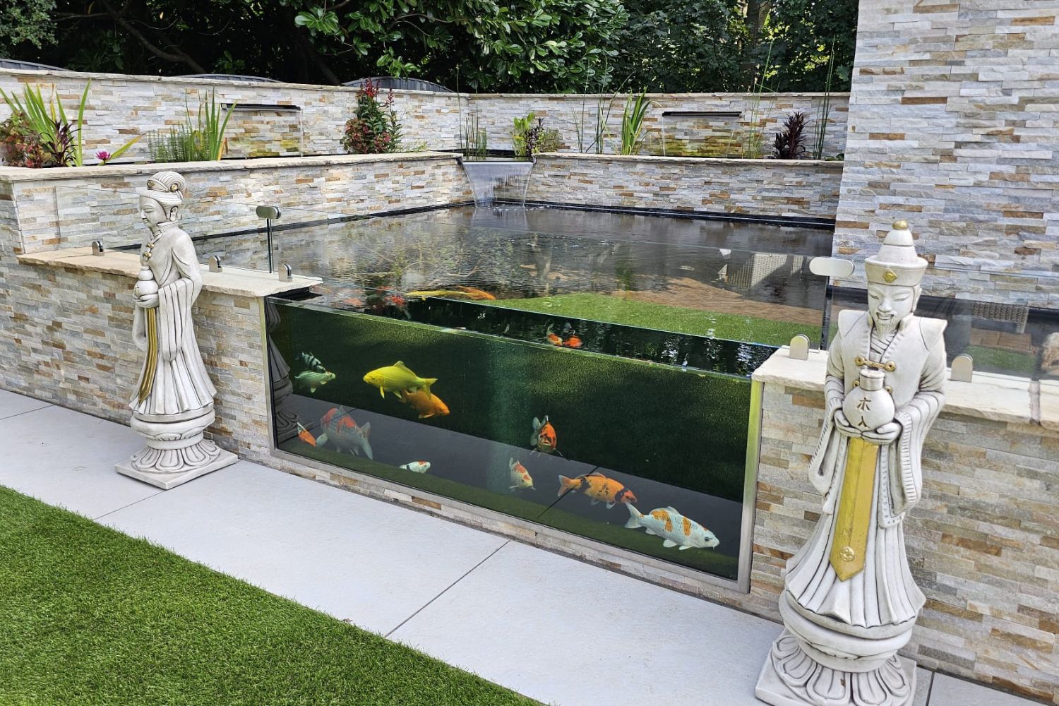 Spectacular raised contemporary Koi pond in Runcorn, Cheshire.