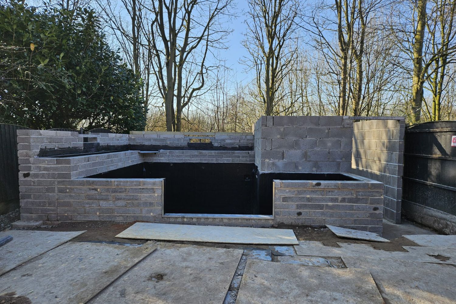 Spectacular raised contemporary Koi pond in Runcorn, Cheshire.