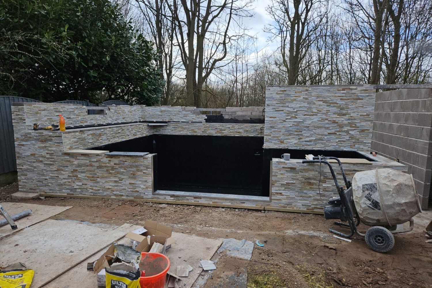 Spectacular raised contemporary Koi pond in Runcorn, Cheshire.